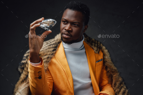 Elegeant african man with diamond in dark background Stock Photo by ...