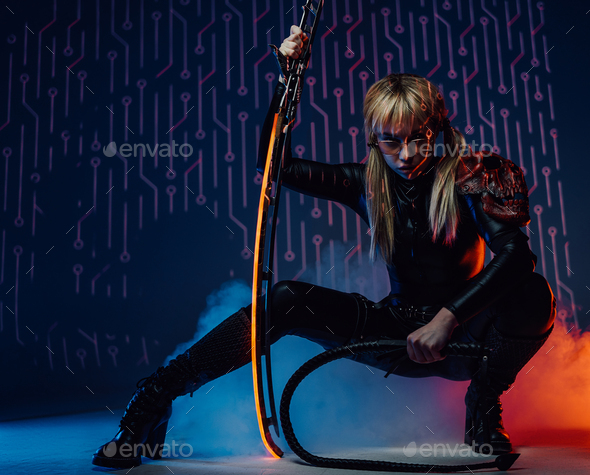 Futuristic female fighter with whip and sword Stock Photo by fxquadro