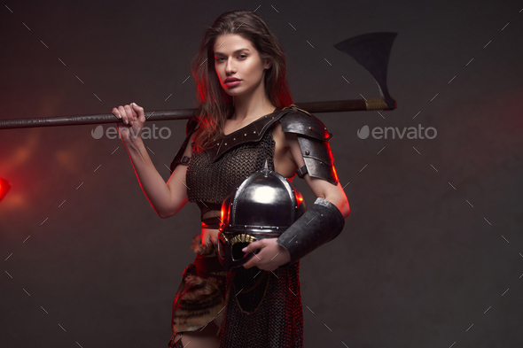 Nordic woman viking with axe on her shoulder Stock Photo by fxquadro