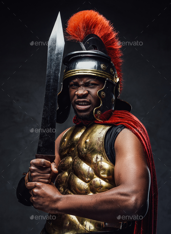 Angry roman soldier with sword against dark background Stock Photo by ...
