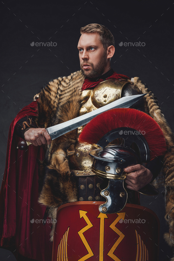 Roman legionnaire in bronze armor with gladius Stock Photo by fxquadro