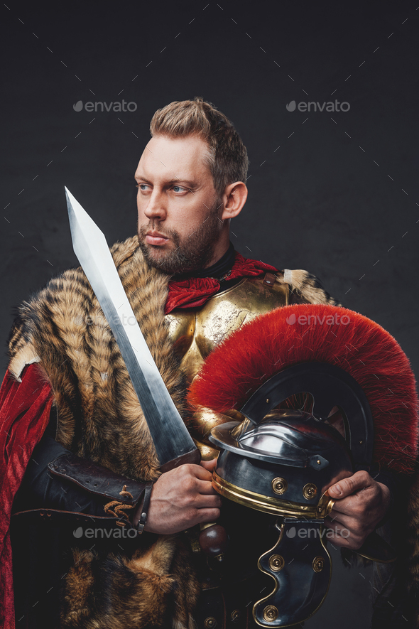 Legionnaire in fur and golden armor with gladius Stock Photo by fxquadro
