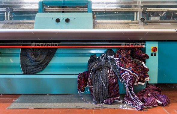 Knitted fabric coming out of a commercial knitting machine Stock Photo ...