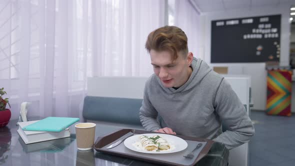 Male Student Smelling Delicious Dessert in Canteen Smiling, Stock Footage