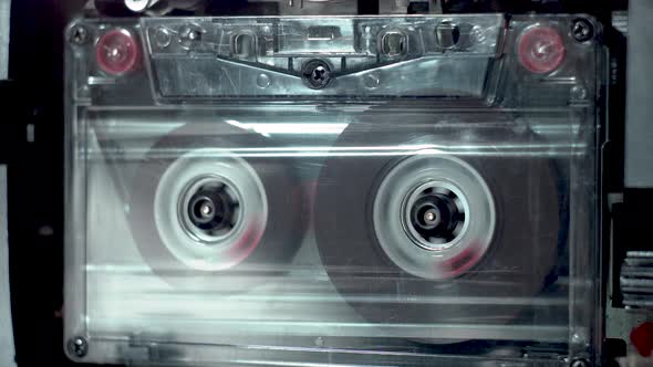 vintage audio cassette fast forwarding and then playback in tape deck ...