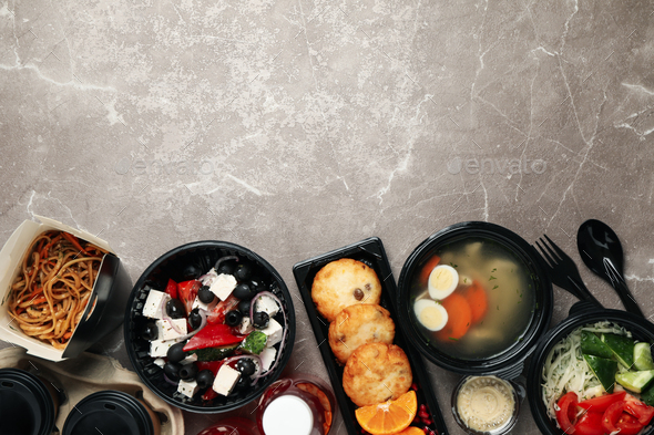 Food delivery. Food in takeaway boxes on table Stock Photo by AtlasComposer