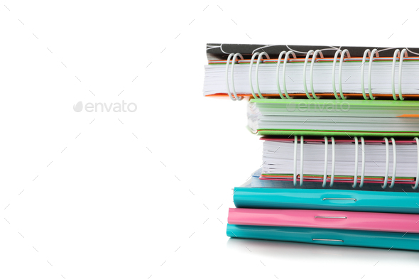 Pile of copybooks isolated on white background Stock Photo by AtlasComposer