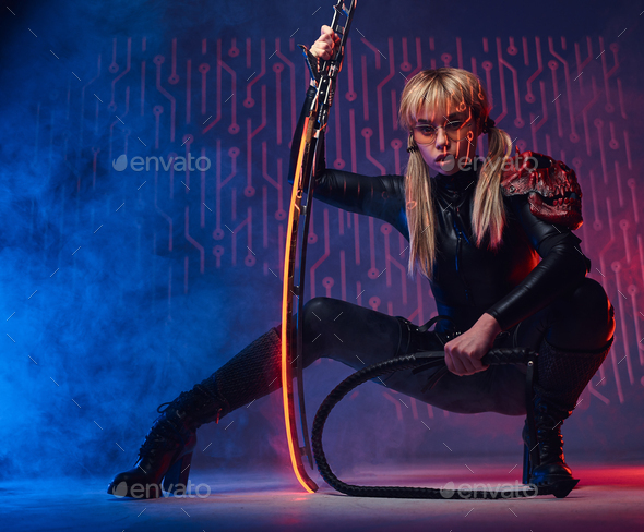 Futuristic female fighter with whip and sword Stock Photo by fxquadro