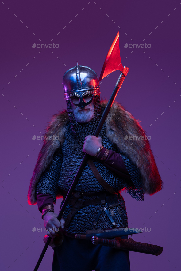 Elder violent knight with axe dressed in chain mail Stock Photo by fxquadro