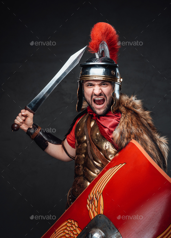 Violent roman soldier screams against dark background Stock Photo by ...
