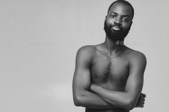 Close up portrait of a handsome young black man Stock Photo by prostooleh