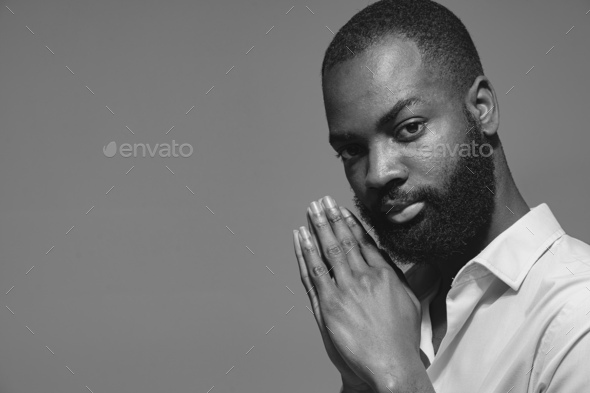 Close up portrait of a handsome young black man Stock Photo by prostooleh