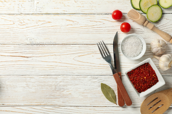 Composition with kitchen cutlery and ingredients for cooking on white ...