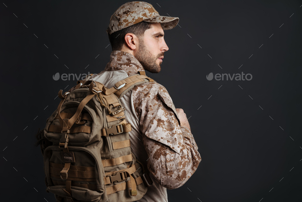 Confident masculine military man in uniform posing with backpack Stock ...