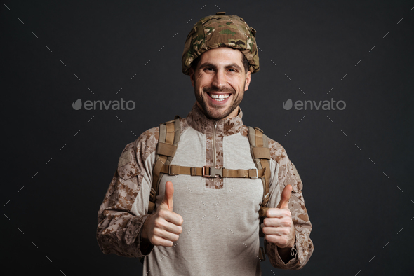 Happy military man wearing helmet smiling and showing thumb up Stock ...