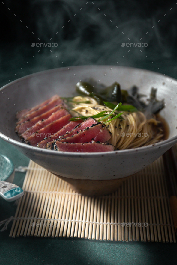 Japanese ramen. Asian soup with noodles ramen, miso, fried tuna steak ...