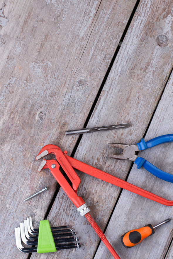 Rustic wooden background with different hardware tools. Stock Photo by ...