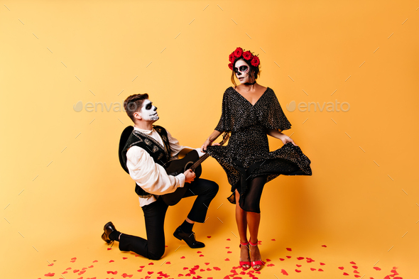 slender Mexican lady dances and plays hem of her dress to sound of ...