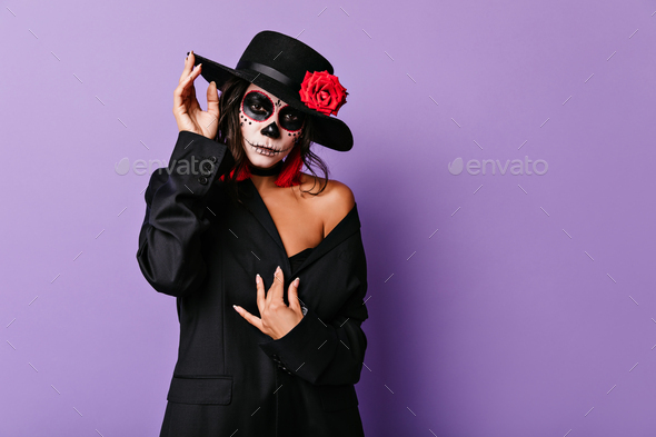Lovable female model in black outfit posing for halloween photoshoot ...