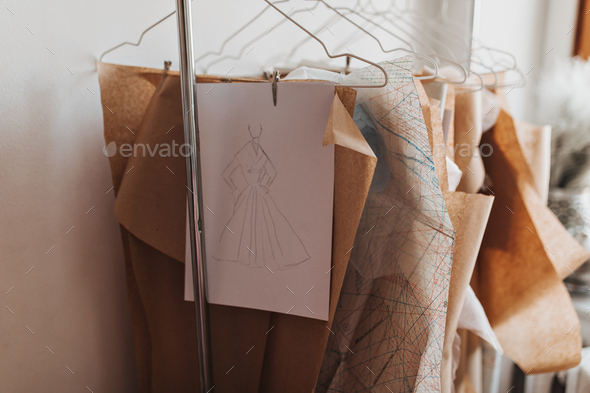 Snapshot of designed clothing patterns. Photo of paper sheets with ...