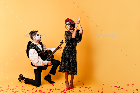Passionate Spanish girl dancing flamenco clapping her hands while ...