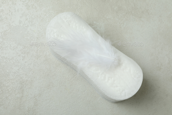 Stack of sanitary pads on white textured background Stock Photo by ...