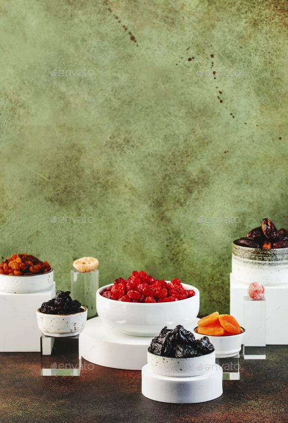 Healthy food snacks: natural dried fruits in bowls on rusty green ...