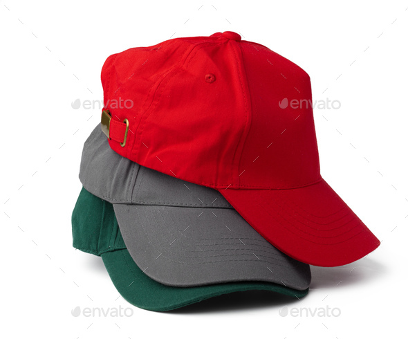 Stack of baseball caps isolated on white background Stock Photo by ...