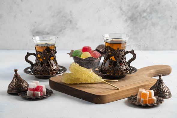 Sweet candies and fragrant teas. Traditional tea set Stock Photo by ...