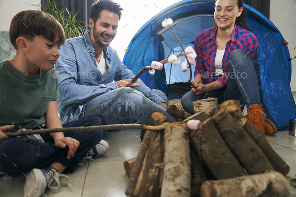 Happy family spending time together during camping at home Stock Photo ...