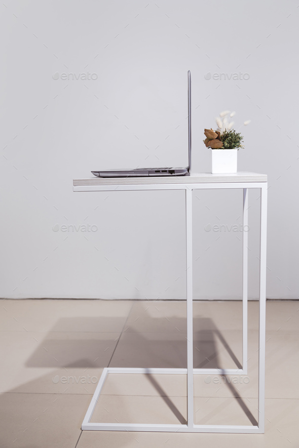 Minimalist lifestyle. laptop on coffee table side view with copy space ...