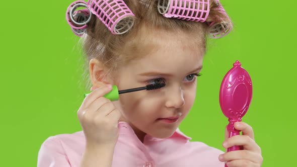 Babies Look in the Mirror and Paint Mascara Eyelashes. Green Screen ...