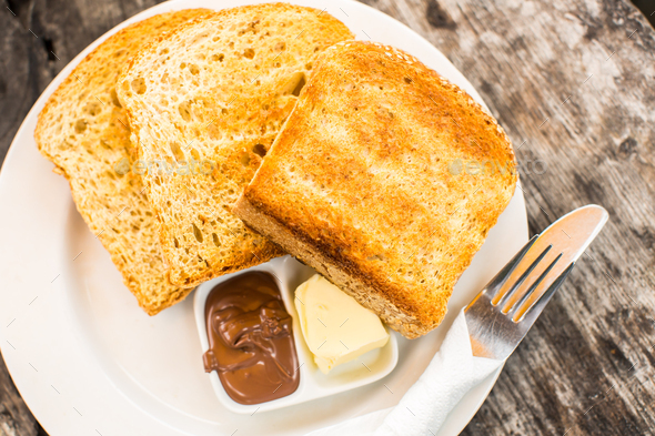 Perfect breakfast. Toast with butter and chocolate paste Stock Photo by ...