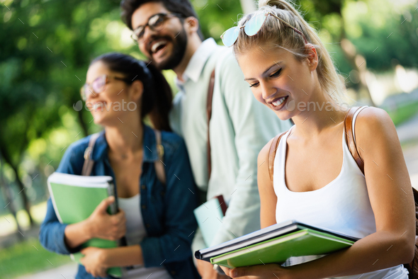 College students studying on university campus outdoor Stock Photo by ...