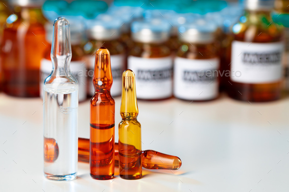 Pile of glass medical vials with medication on lab table Stock Photo by ...