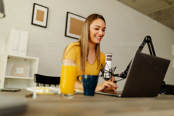 Female podcaster making audio podcast from her home studio. Stock Photo ...