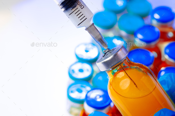 Medical vial with medication and syringe close up Stock Photo by ...
