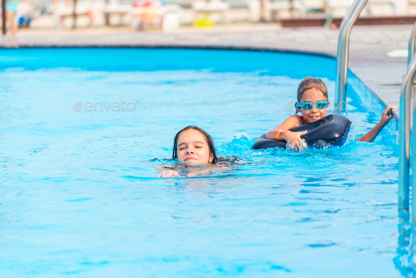 Two little sisters girls are swimming Stock Photo by YouraPechkin ...
