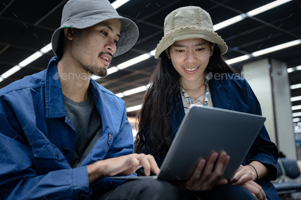 business man sitting and using laptop computer to work at the airport ...