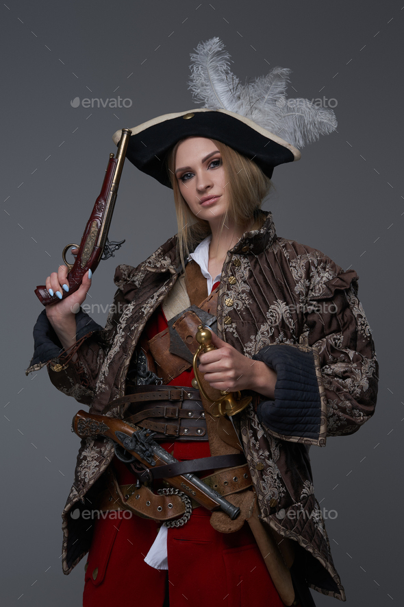 Medieval woman pirate with saber and handgun Stock Photo by fxquadro