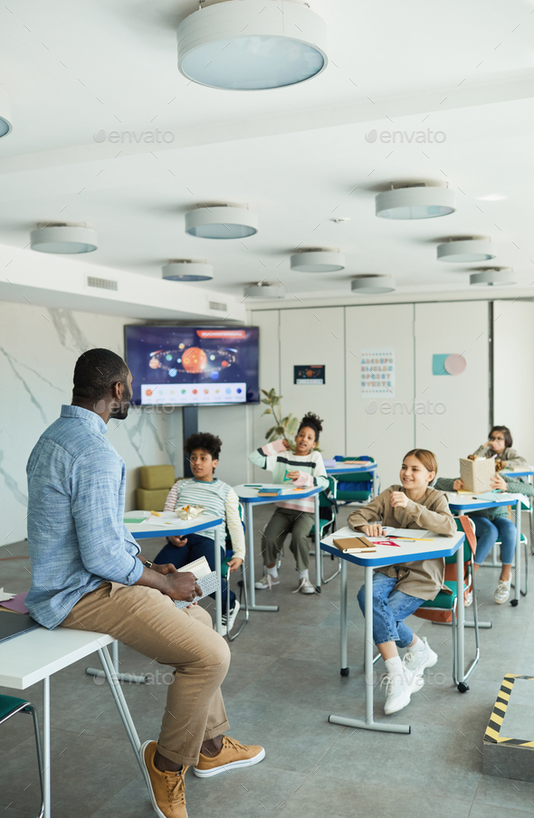 Young Kids in School Lesson Stock Photo by seventyfourimages | PhotoDune