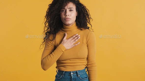 African American woman with dark fluffy hair knocking chest and Stock ...