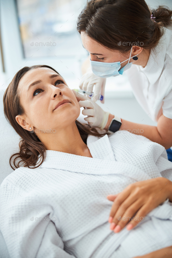 Attractive spa client getting a subcutaneous injection Stock Photo by ...
