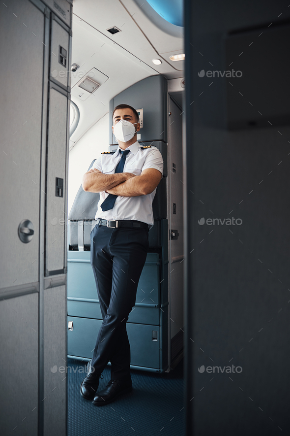 Calm young pilot having short rest after the flight Stock Photo by ...