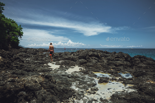 Pure water of ocean and rocks. Bali Stock Photo by Boyarkinamarina