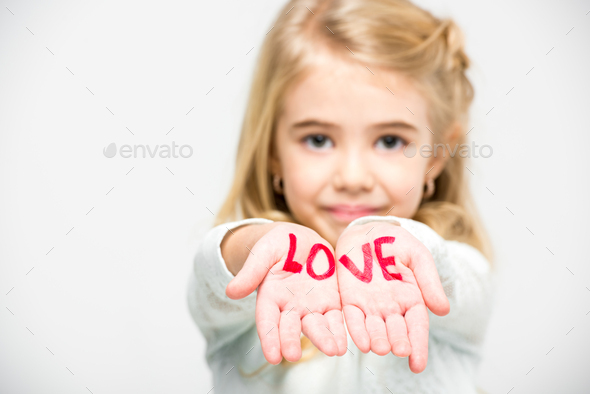 Word love written on palms of cute child girl isolated on white Stock ...