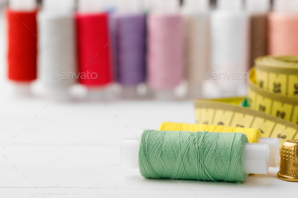 Close up of colored thread coils, thread spools background Stock Photo ...