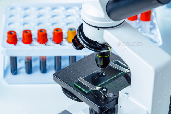 Microscope with blood samples test tubes close up Stock Photo by ...