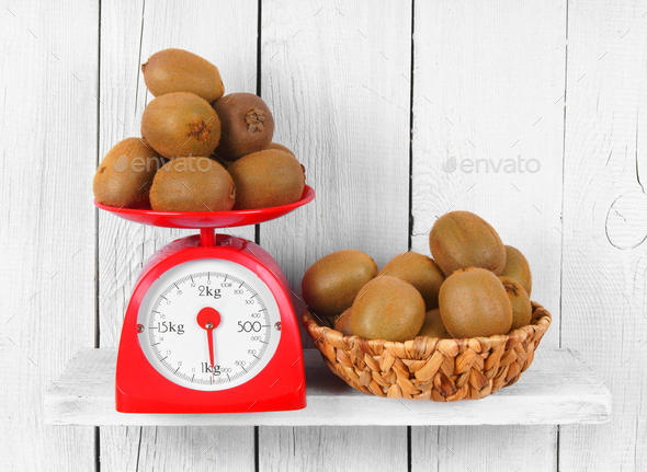 Kiwi on scales and in a basket Stock Photo by Artem_ka | PhotoDune
