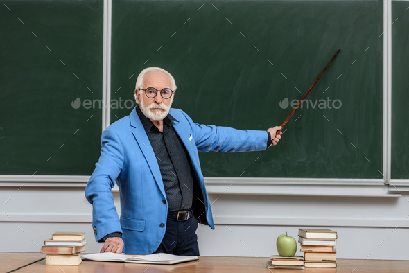 grey hair professor pointing on something at blackboard Stock Photo by ...